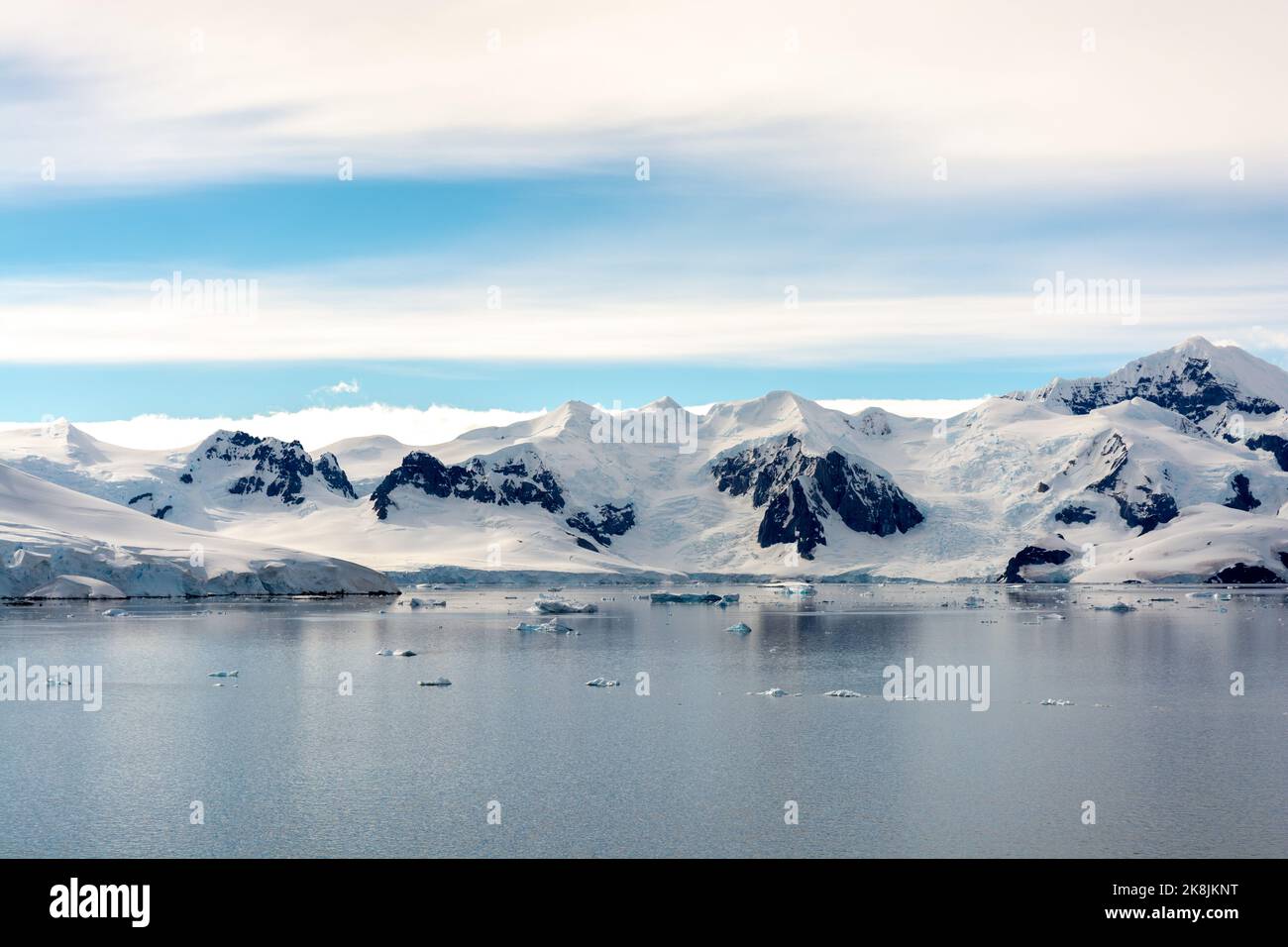 looking past munoz point on lemaire island (l) to paradise harbour (bay ...