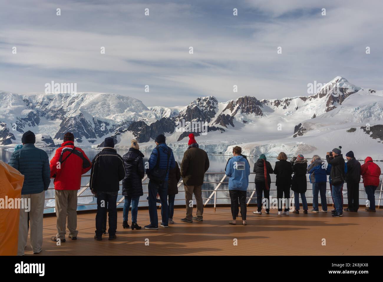passengers viewing on deck of cruise ship in paradise harbour (bay ... passengers viewing on deck of cruise ship in paradise harbour (bay ...