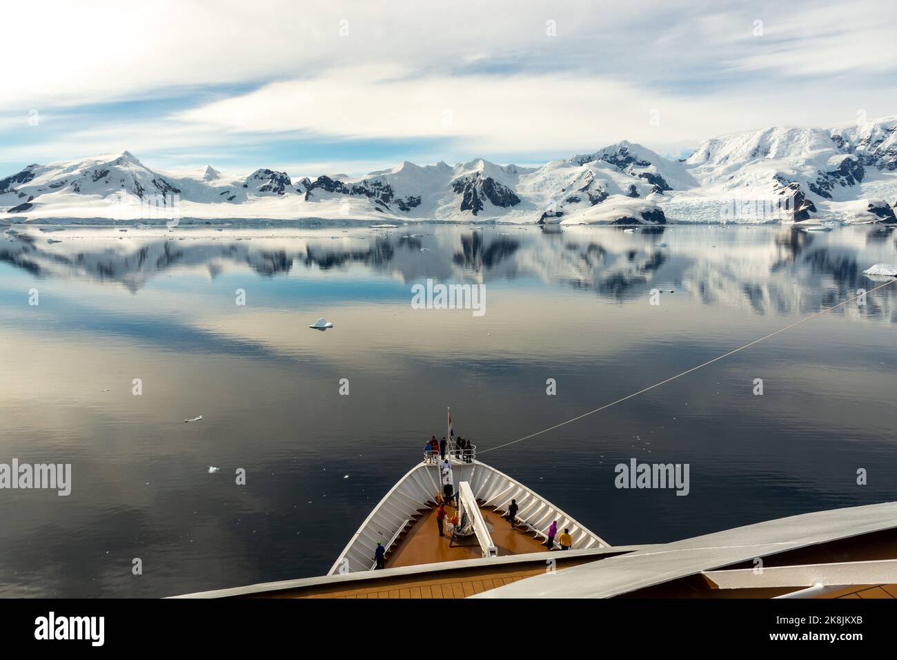 cruising in still waters of paradise harbour (bay) with peaks of danco ...