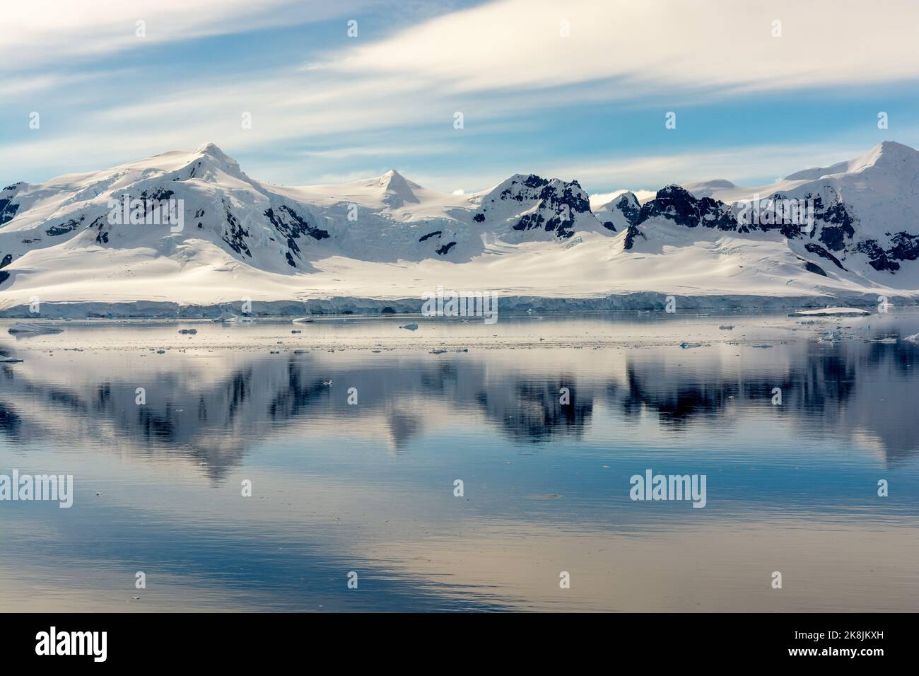 still waters of paradise harbour (bay) with peaks of danco coast ...