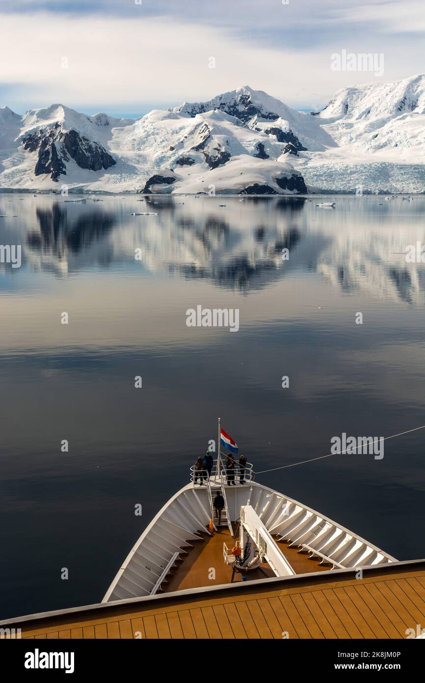 cruising in still waters of paradise harbour (bay) with peaks of danco ...