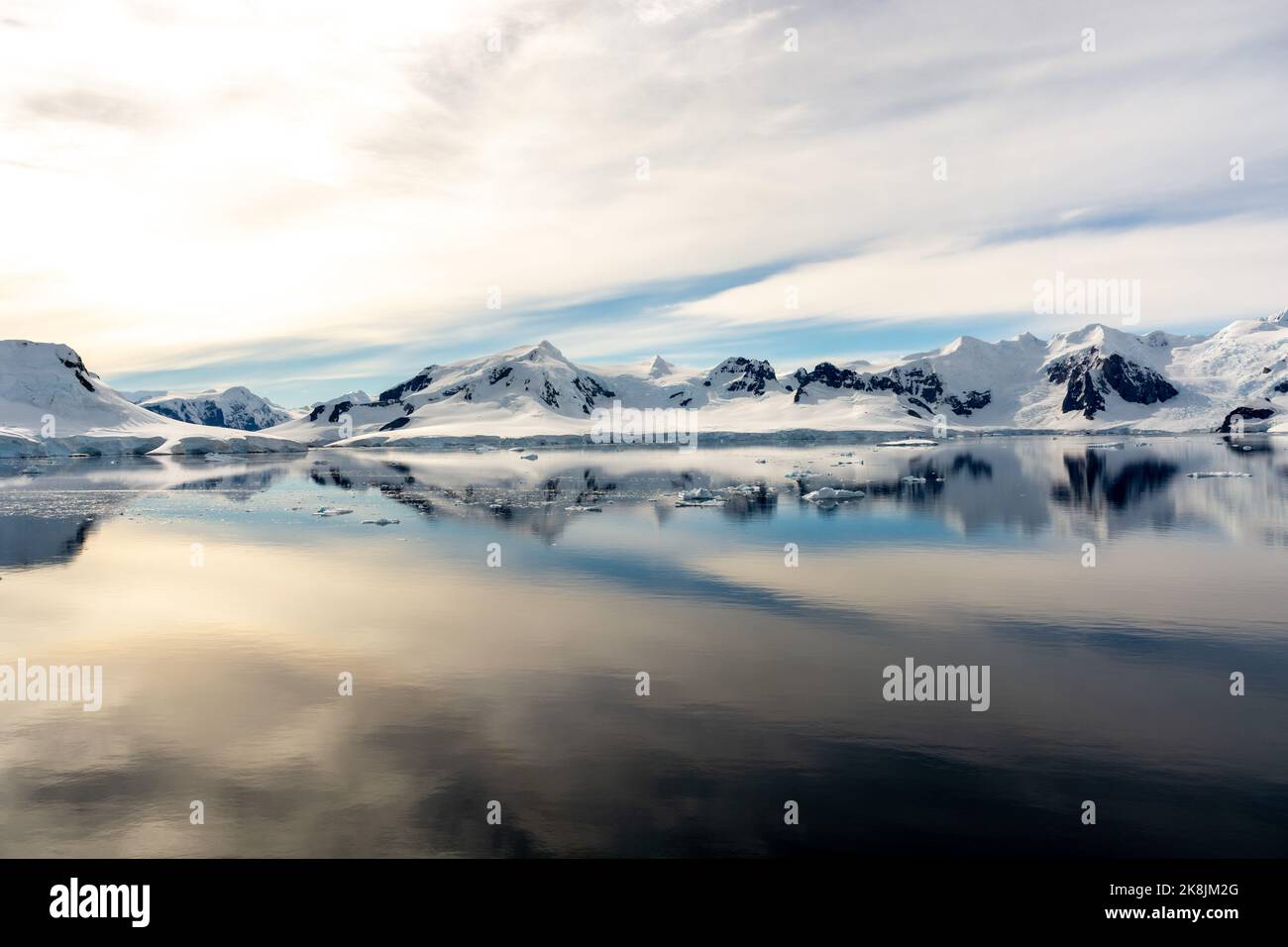 still waters of paradise harbour (bay) with peaks of danco coast ...