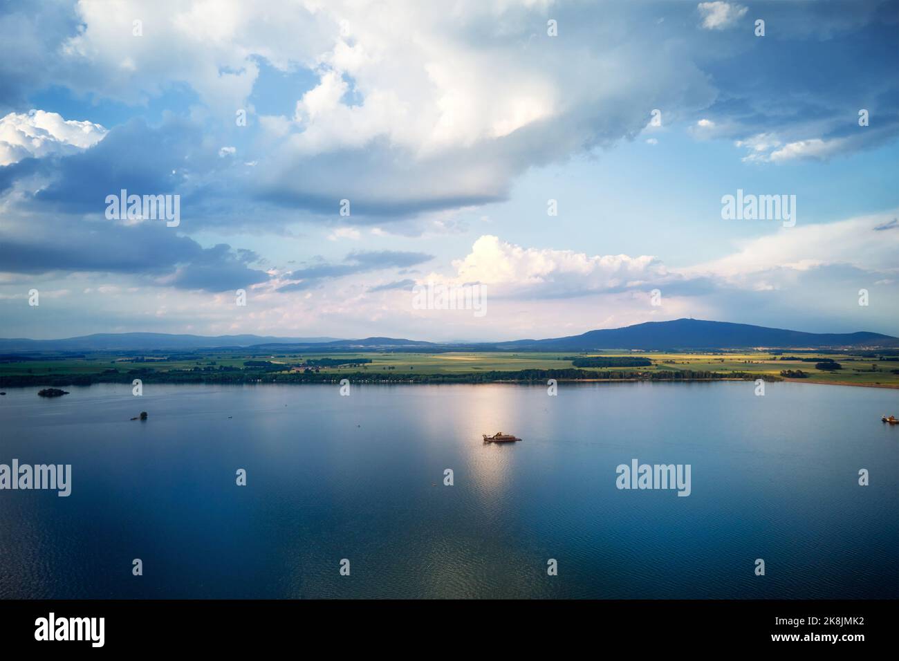 Aerial top view of beautiful landscape with large lake against ...