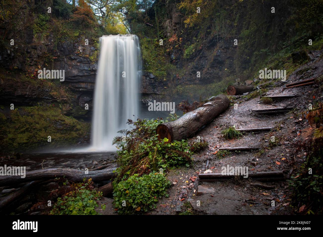 Water flowing over Henrhyd Falls, the highest waterfall in South Wales ...