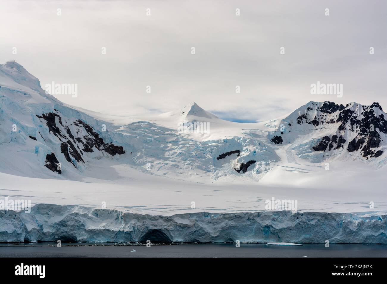snow and icy shoreline. paradise harbour (bay). west coast of graham ...