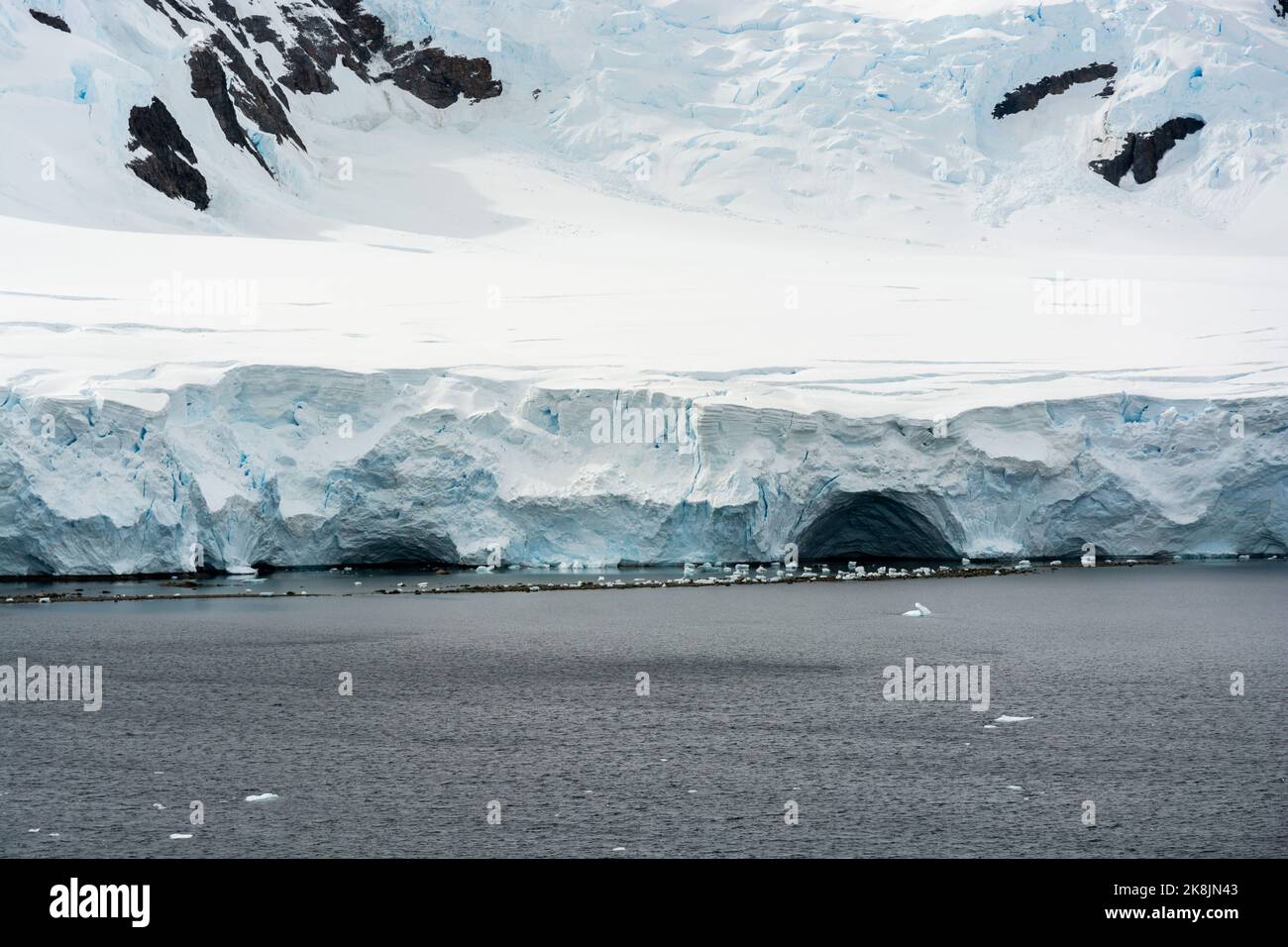 snow and icy shoreline. paradise harbour (bay). west coast of graham ...