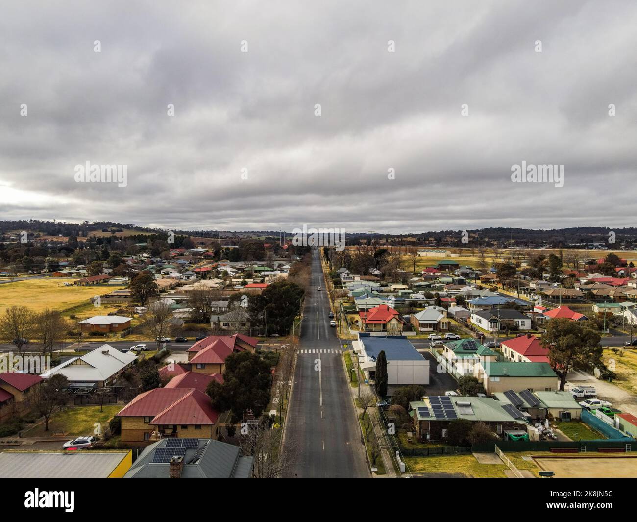 An aerial view of the town of Armidale with old buildings and traffic ...