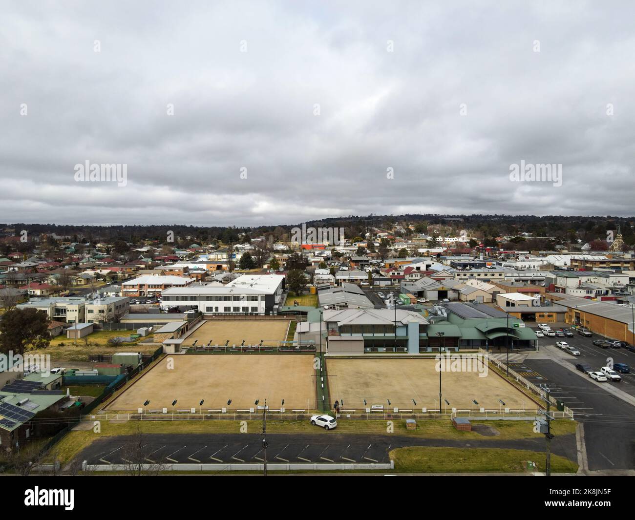 An aerial view of the town of Armidale with buildings and traffic on ...