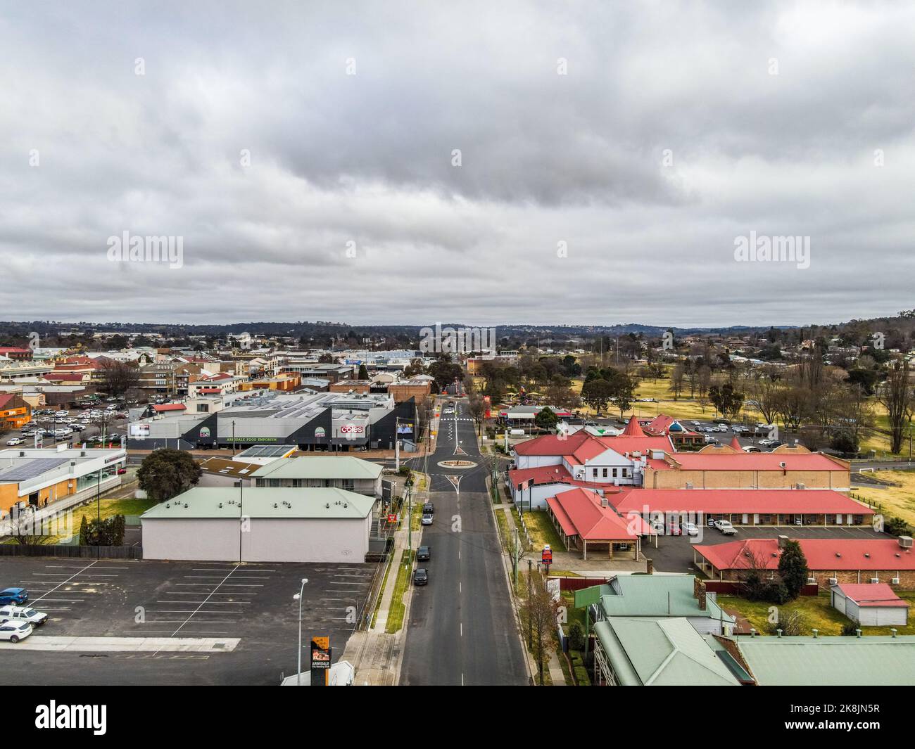 An aerial view of the town of Armidale with buildings and traffic on ...