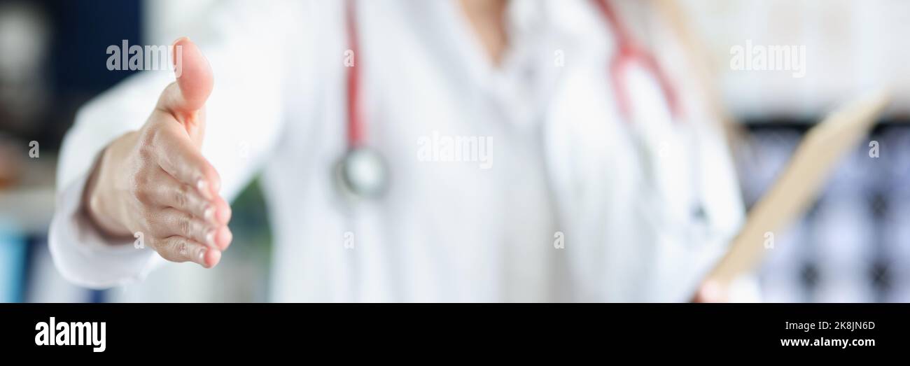Doctor woman give hand to greet someone, medical worker in uniform ...