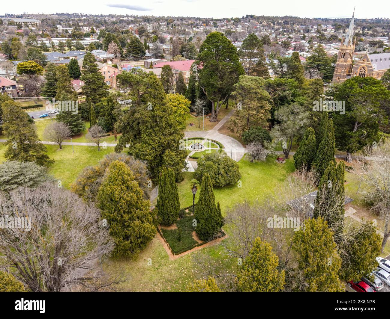 An aerial view of the town of Armidale with buildings, a cathedral, War ...