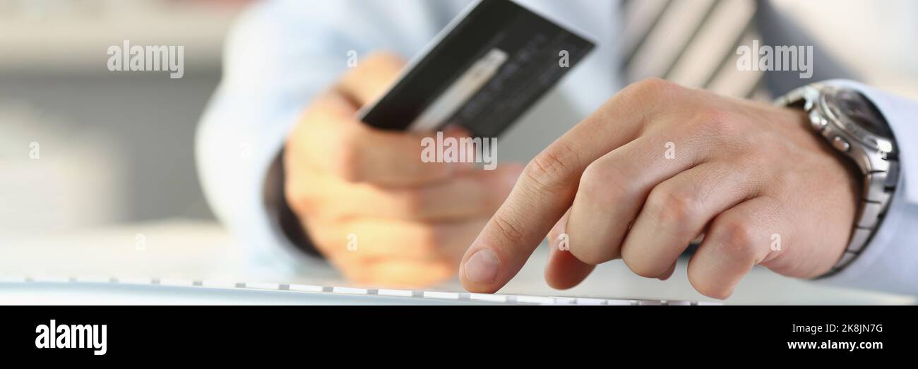 Man press knob on keyboard, pay online use credit card, remote ...