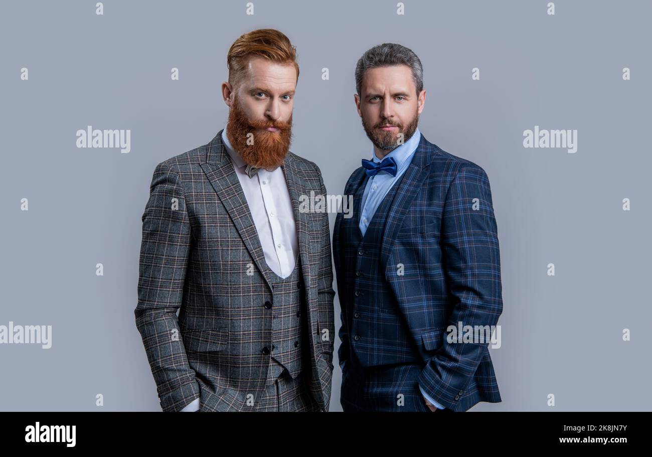 successful two men in tux. studio shot of men wearing tux. elegant men ...