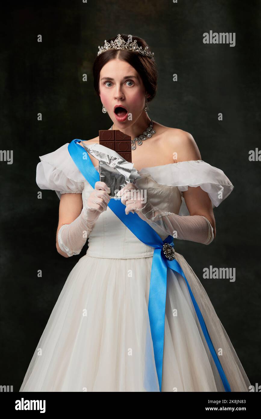 Sweet delight. Elegant woman, royal person, queen or princess in white ...