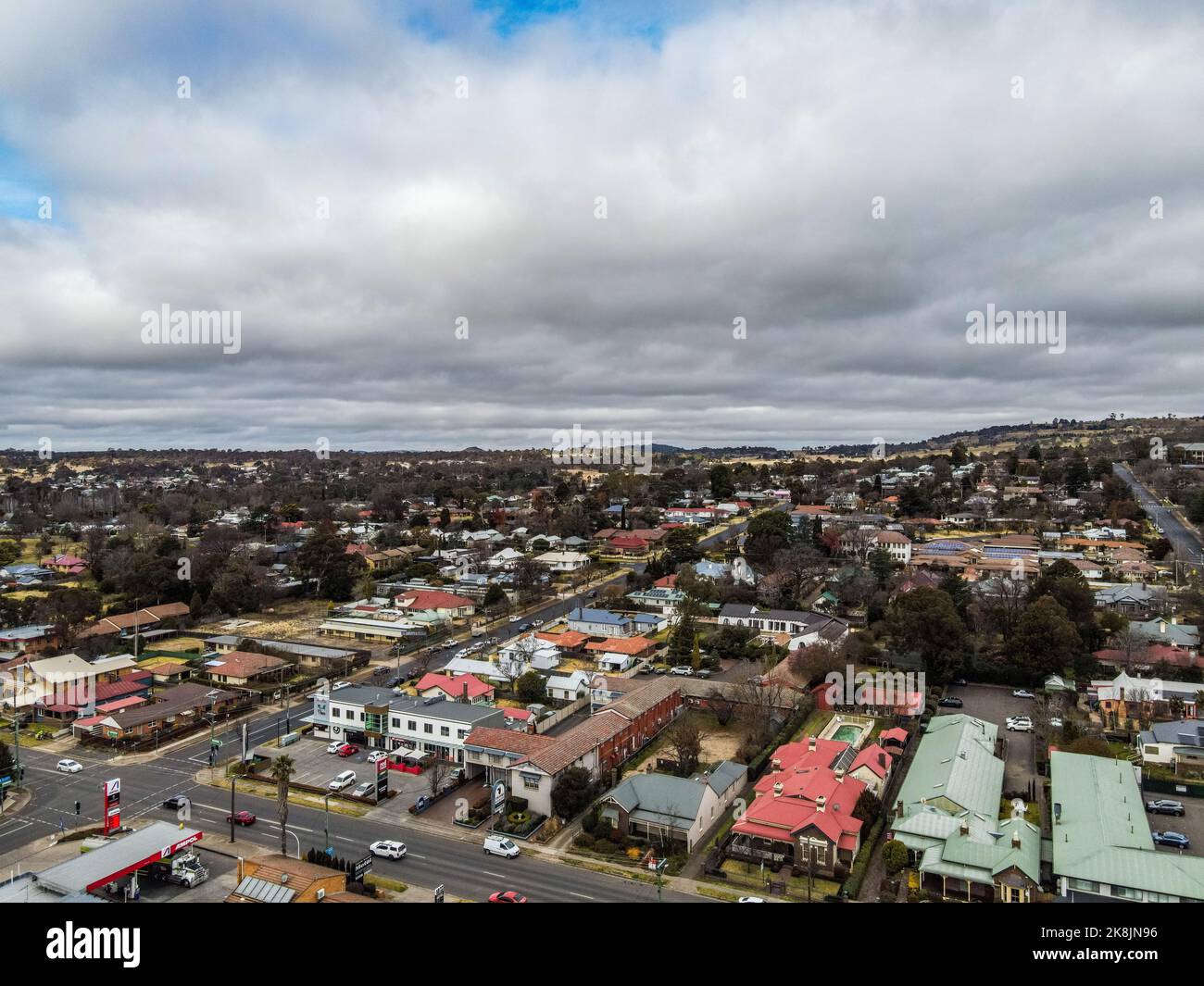 An aerial view of the town of Armidale with buildings and traffic on ...