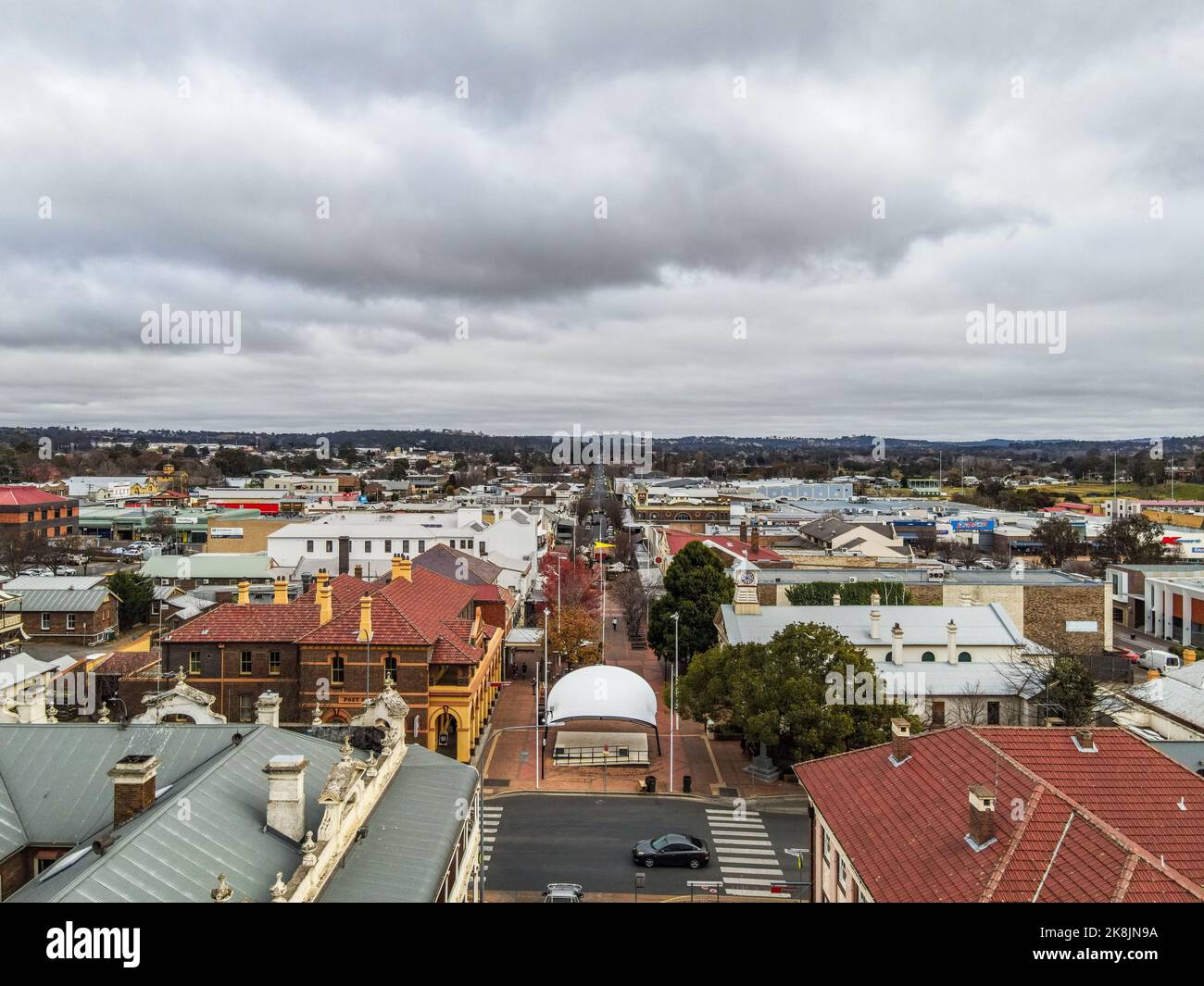 An aerial view of the town of Armidale with buildings and traffic on ...
