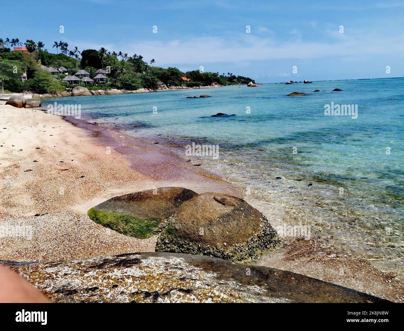 A Seascape with huge rocks on a beach under a sunny sky Stock Photo - Alamy
