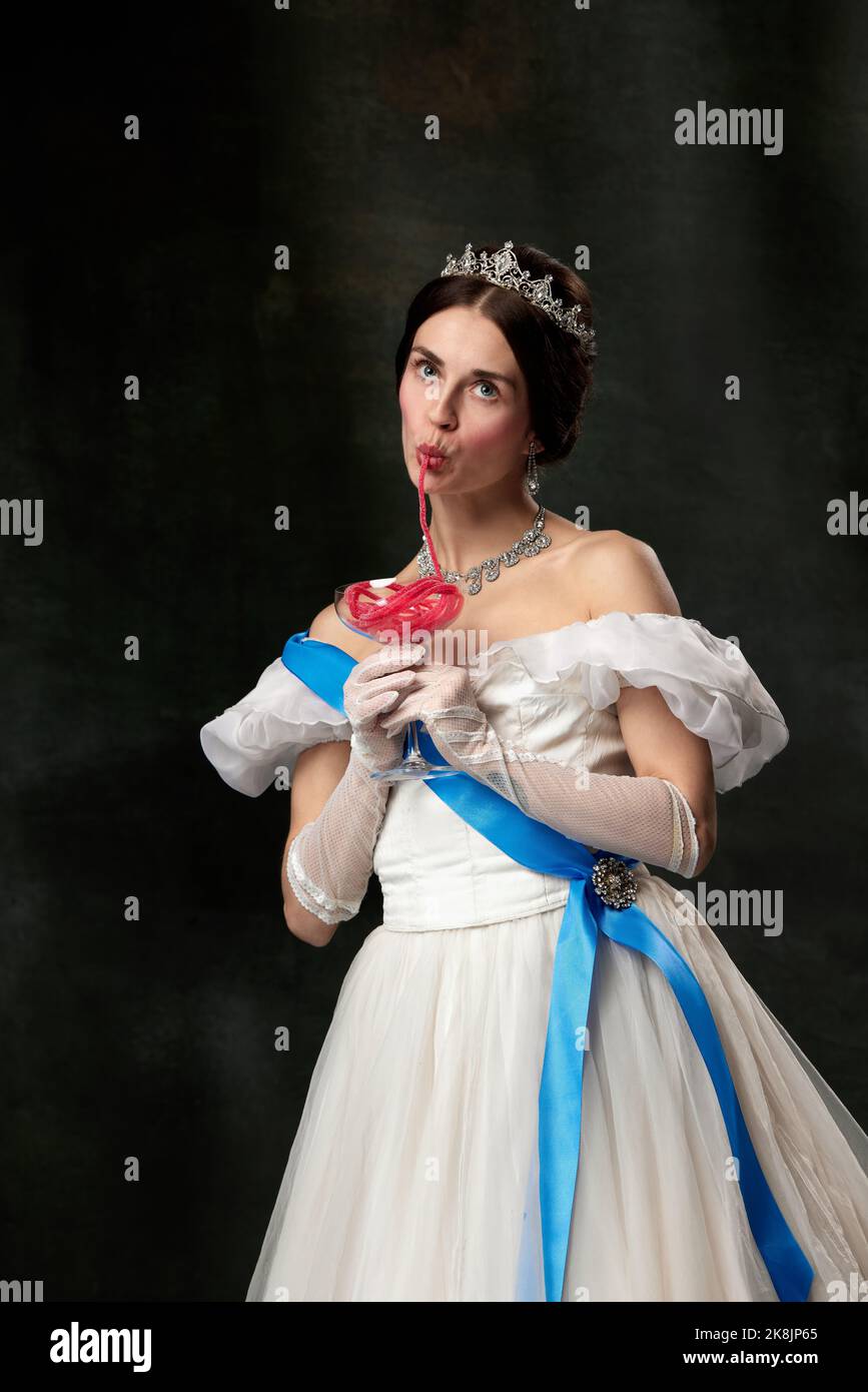 Sweet delight. Elegant woman, royal person, queen or princess in white ...