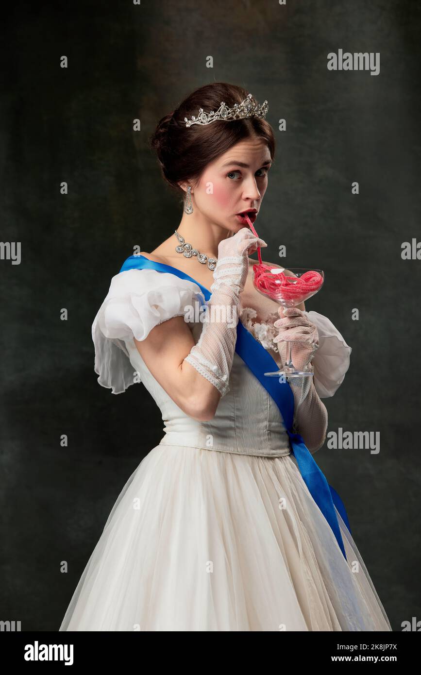 Sweet delight. Elegant woman, royal person, queen or princess in white ...