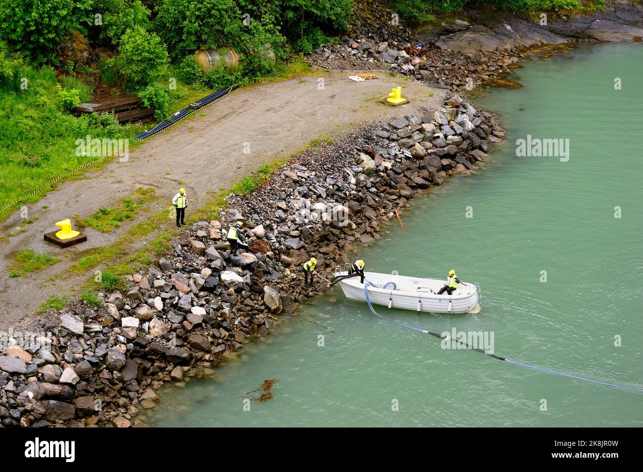 Skjolden, Sognefjord, Norway - 28th June 2022:Workers bringin ashore ...