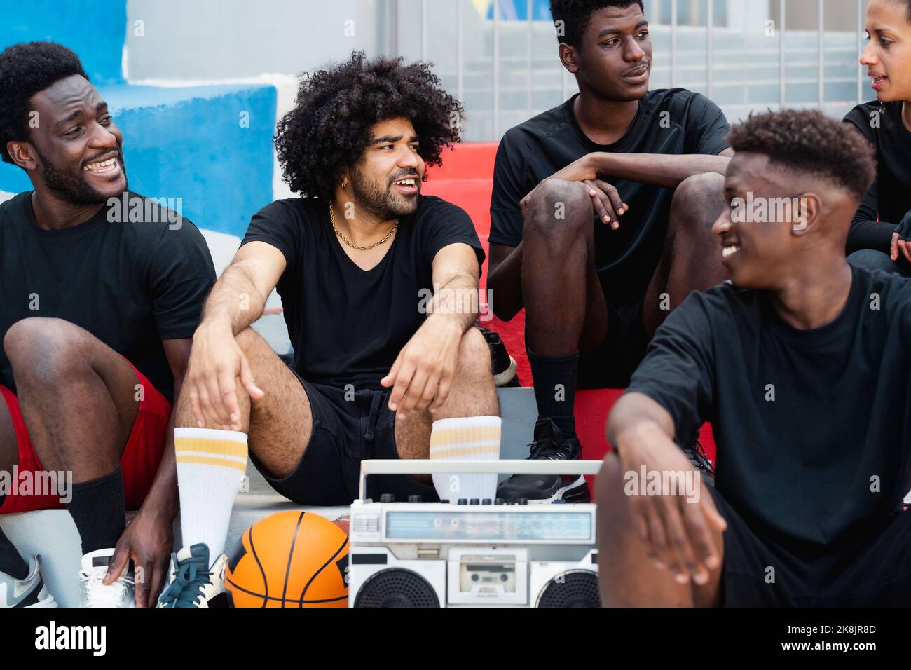 Young multiracial people having fun listening music with vintage ...
