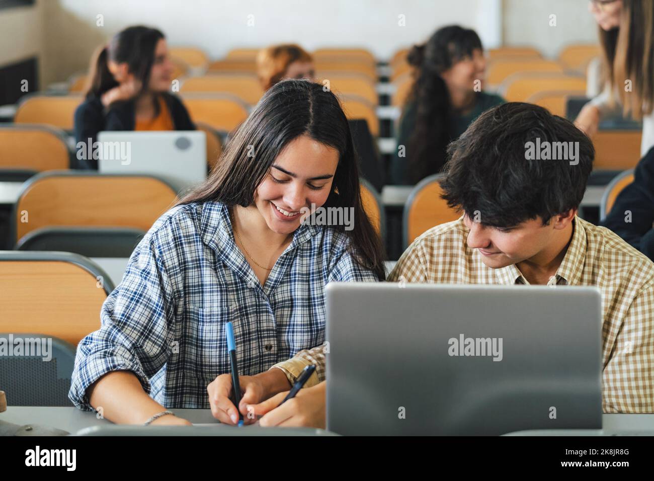Young people studying inside university classroom - School education ...