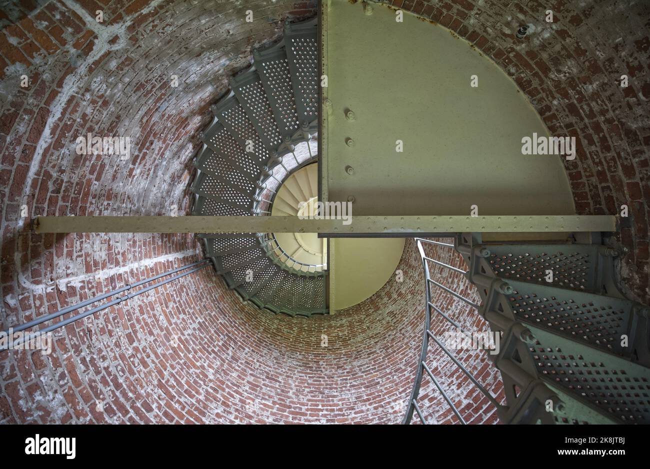 A top view shot of the interiors spiral staircase of the lighthouse ...
