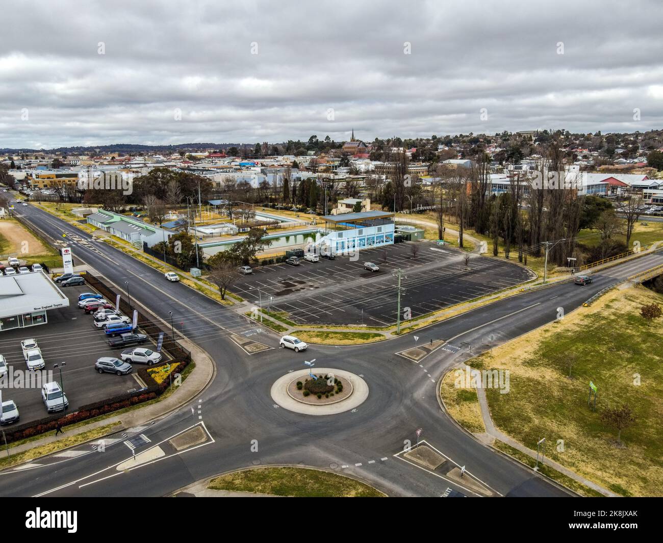 An aerial shot of country town main street and square, cars, parking ...