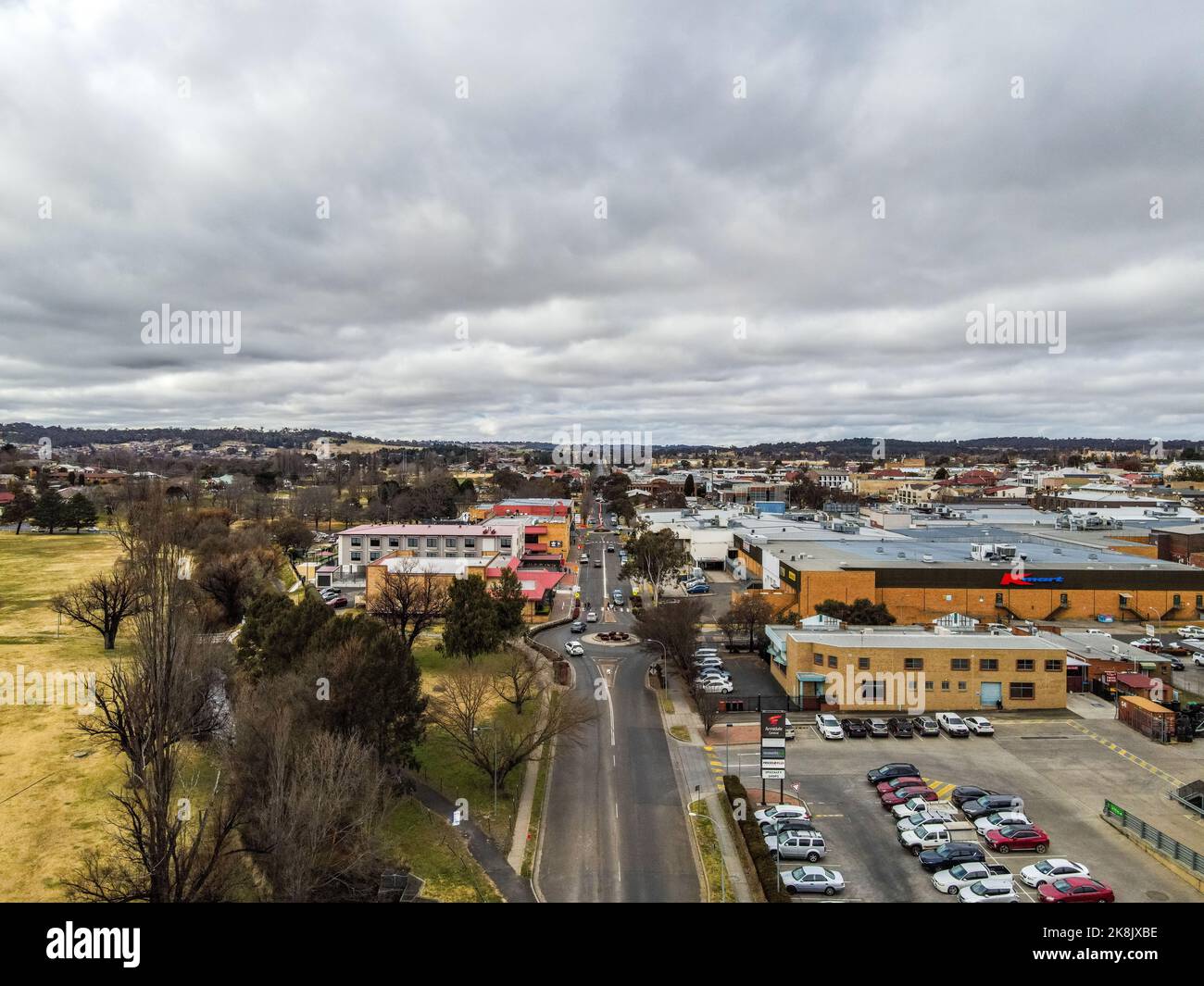 An aerial shot of country town buildings, main street, cars, and the ...