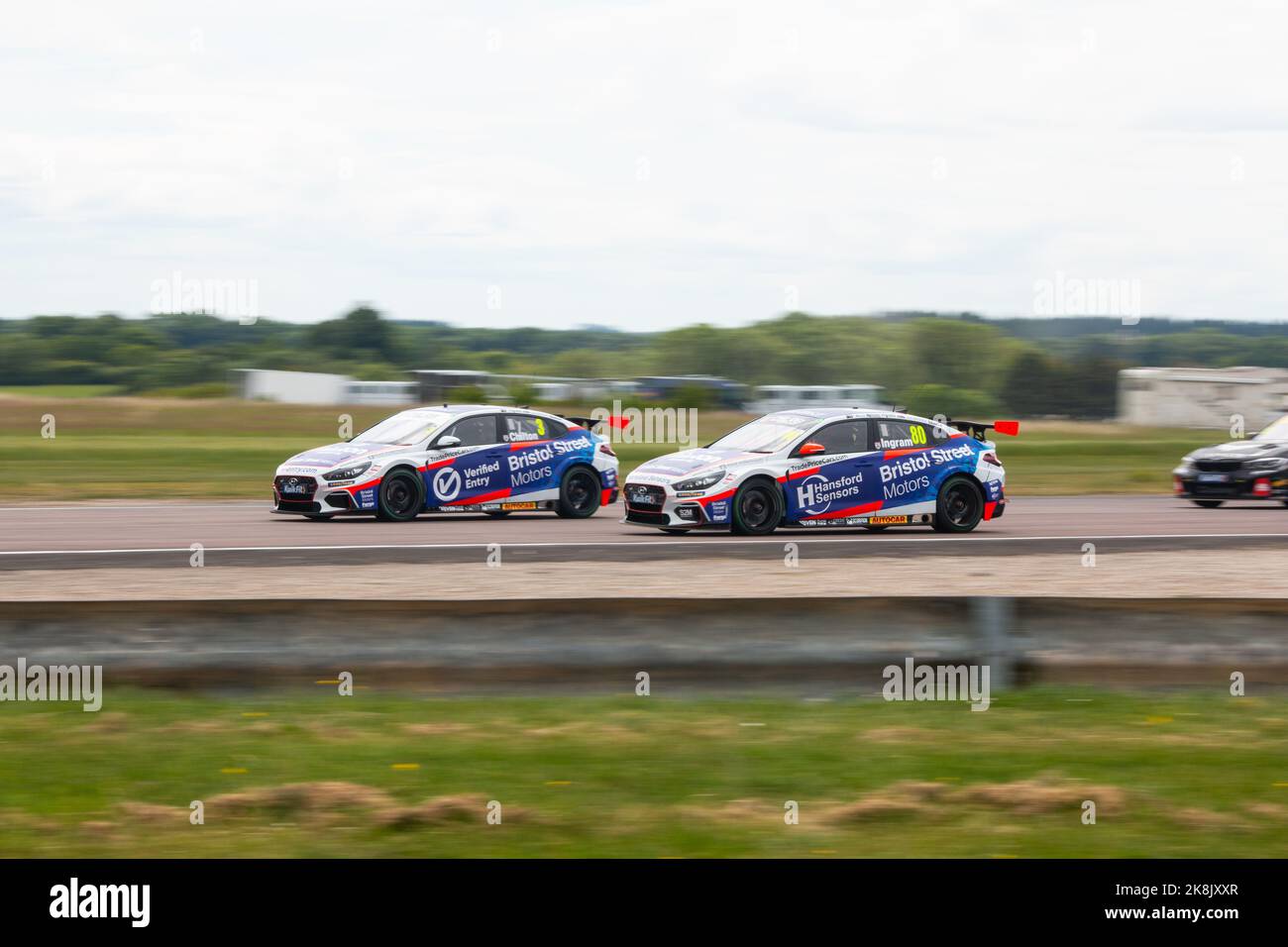 A track with British Touring Cars at Thruxton with blurred background ...