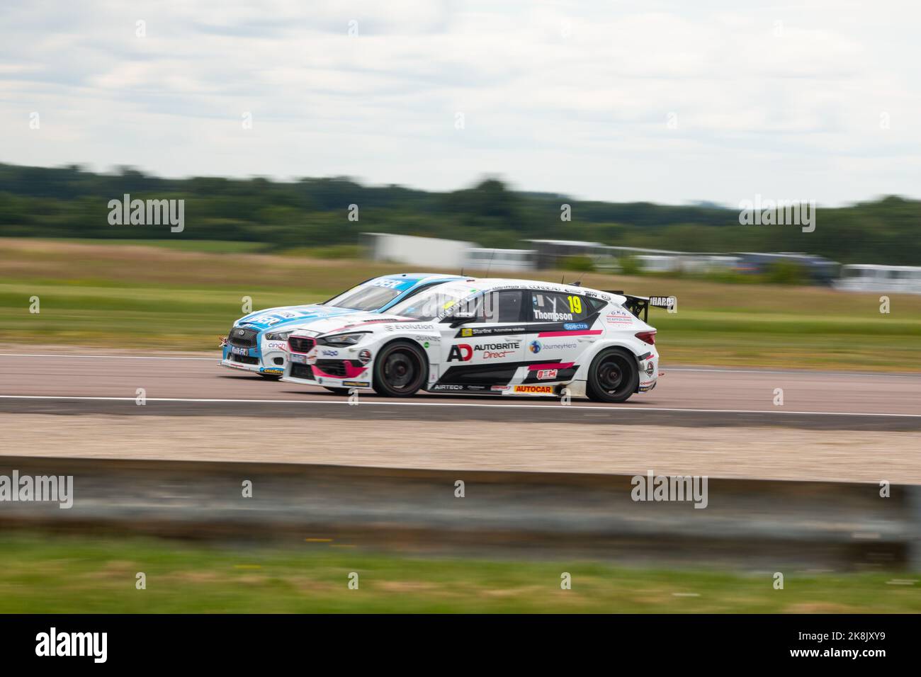 A British Touring Car On The Track At Thruxton With Blurred Background