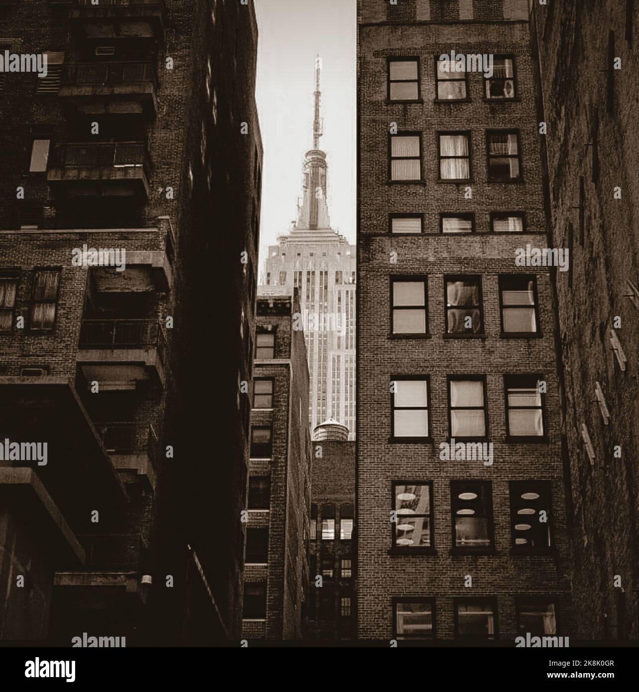 A sepia shot of the buildings of New York city with the Empire State ...