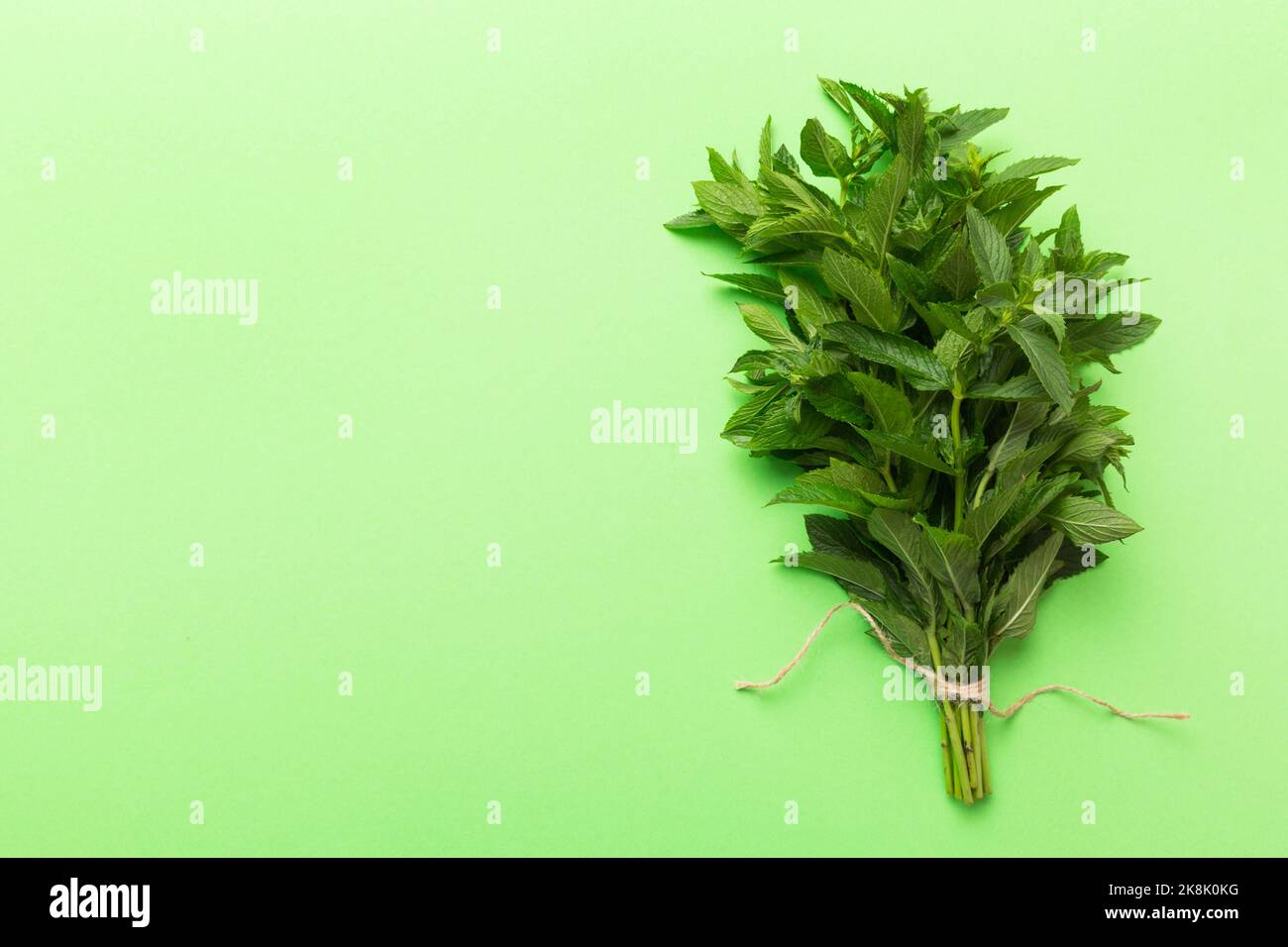 Fresh mint bunch on colored table. Top view with copy space Stock Photo ...