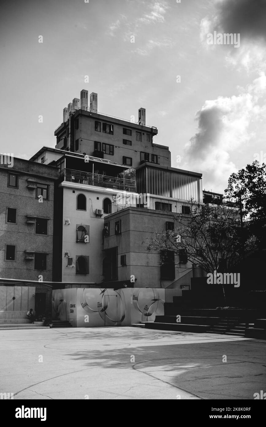 The vertical grayscale view of residential buildings and stairs Stock ...