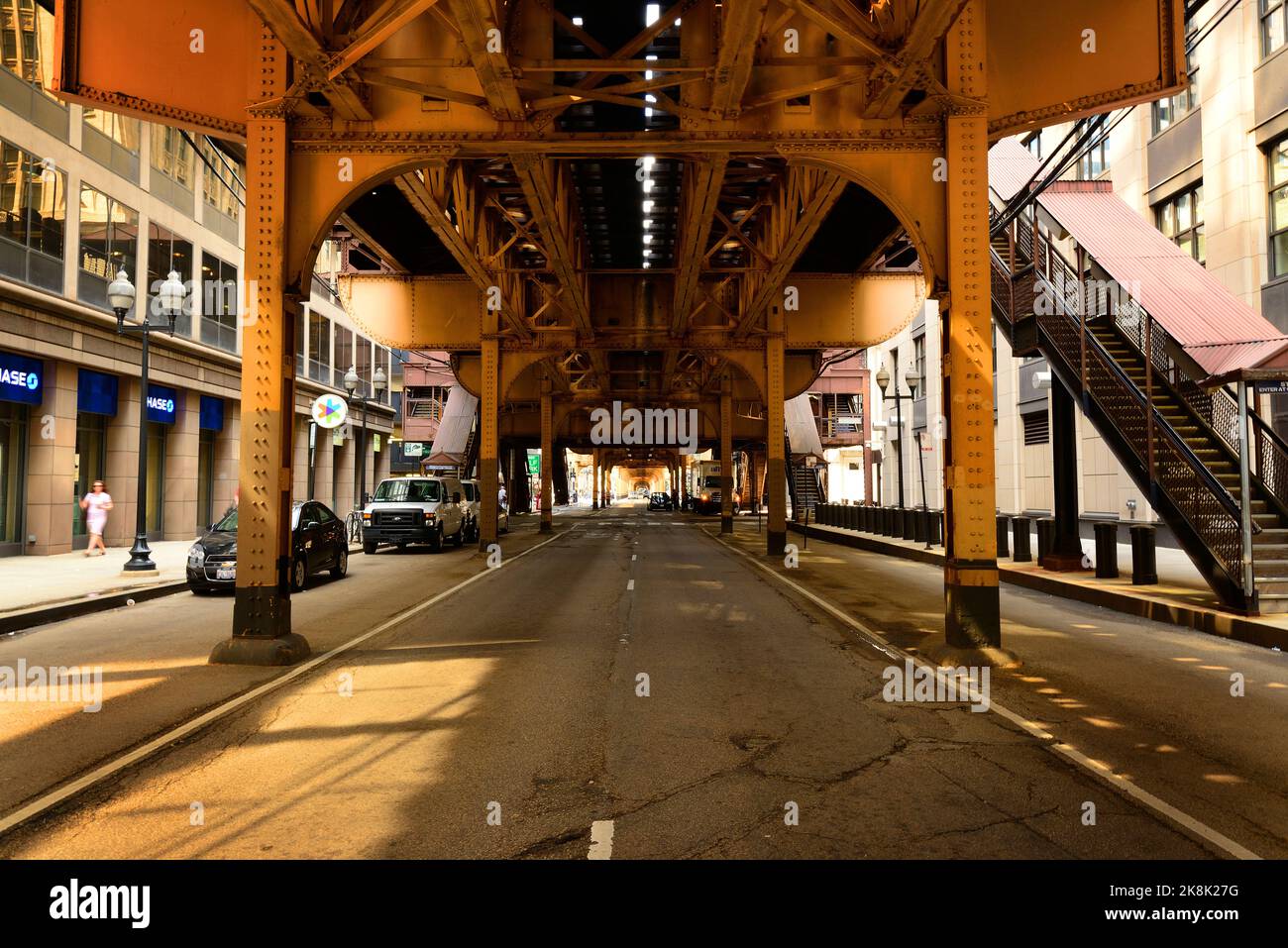 A road running below the railroad in Chicago's elevated rail system ...