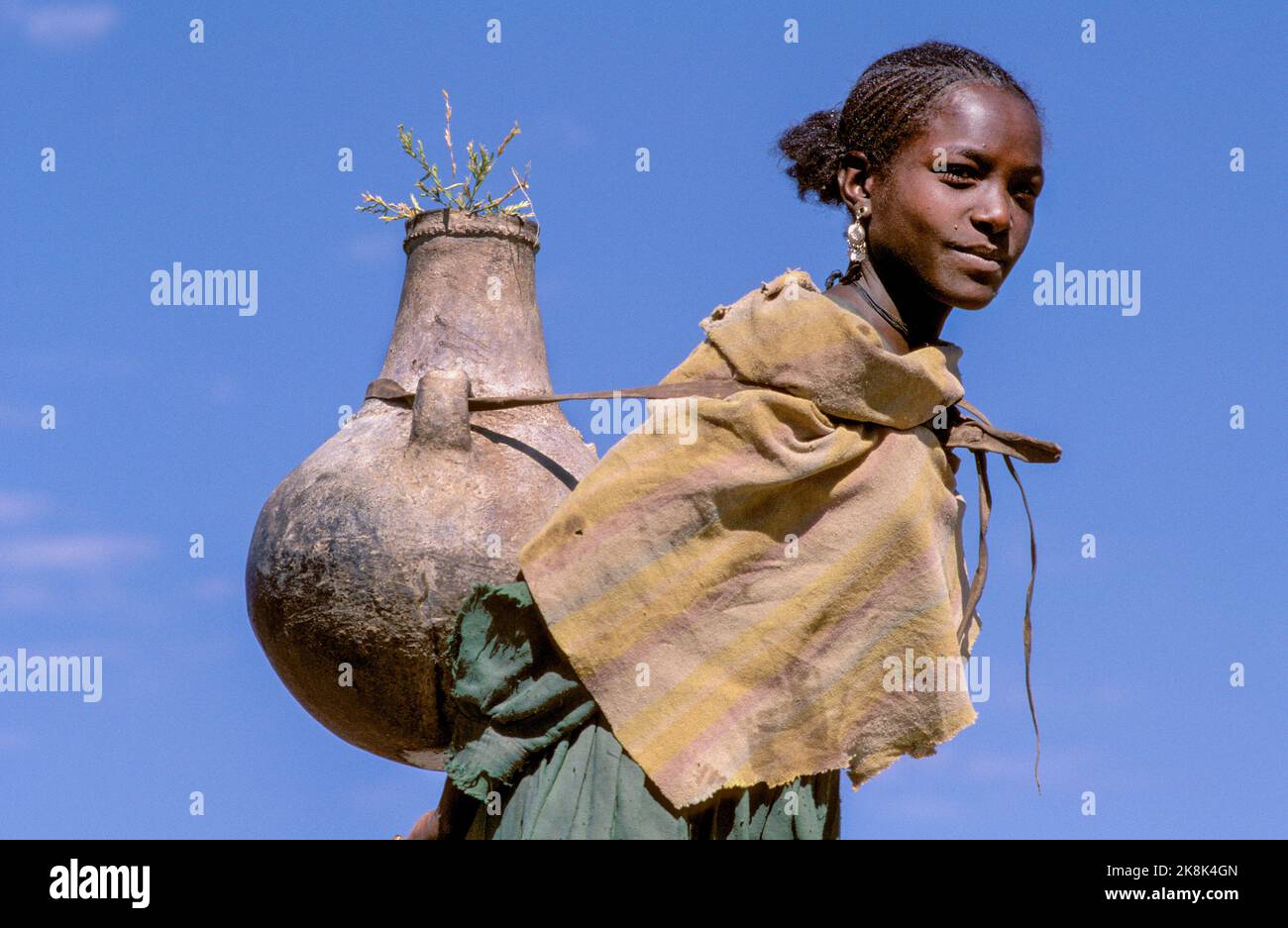 Ethiopia, Tigray; girl carrying a water jar Stock Photo - Alamy