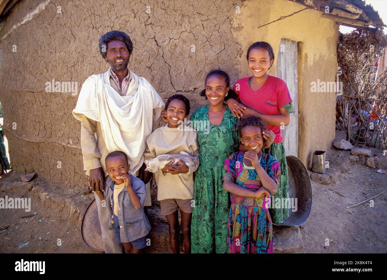 Ethiopia, Addis Abeba; Portrait of a family in front of their adobe ...