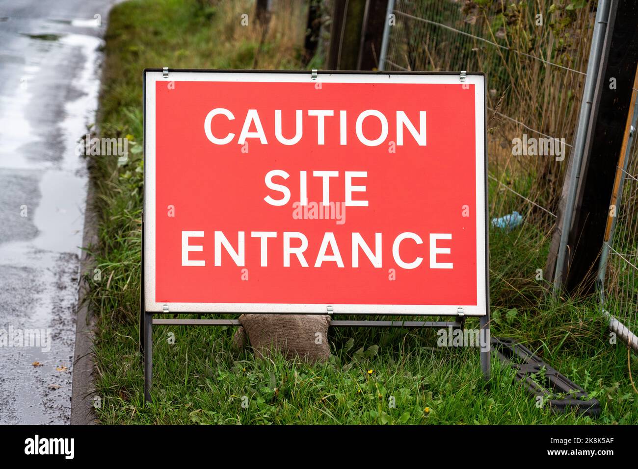 Caution Site Entrance notice Stock Photo - Alamy