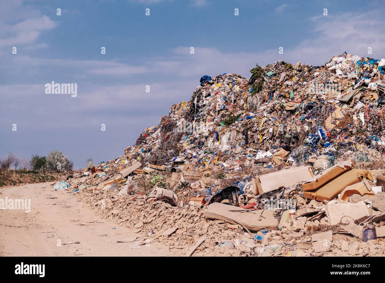 Proof of human negligence. On picture big pile of trash ruining nature ...