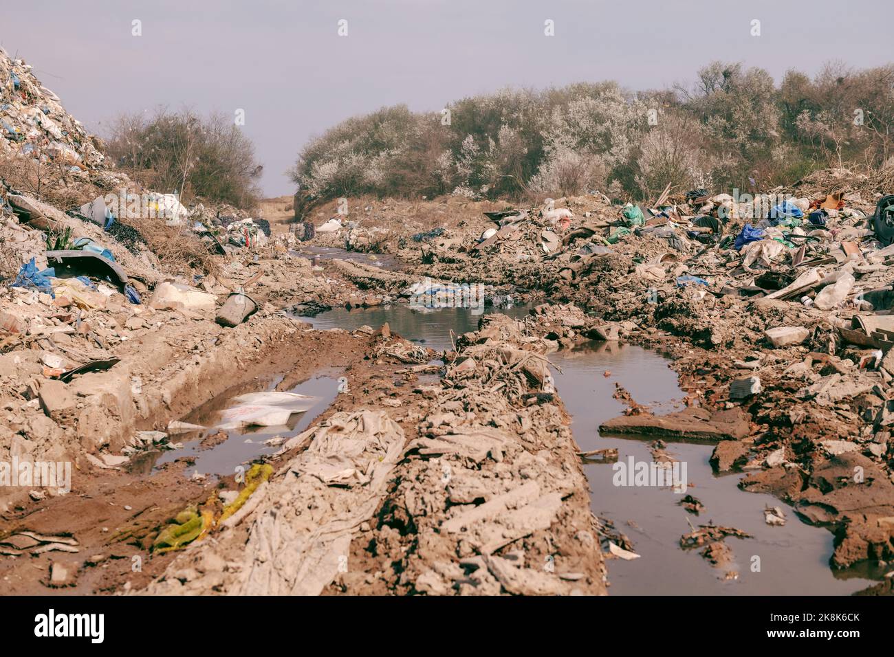 Proof of human negligence. On picture big pile of trash ruining nature ...