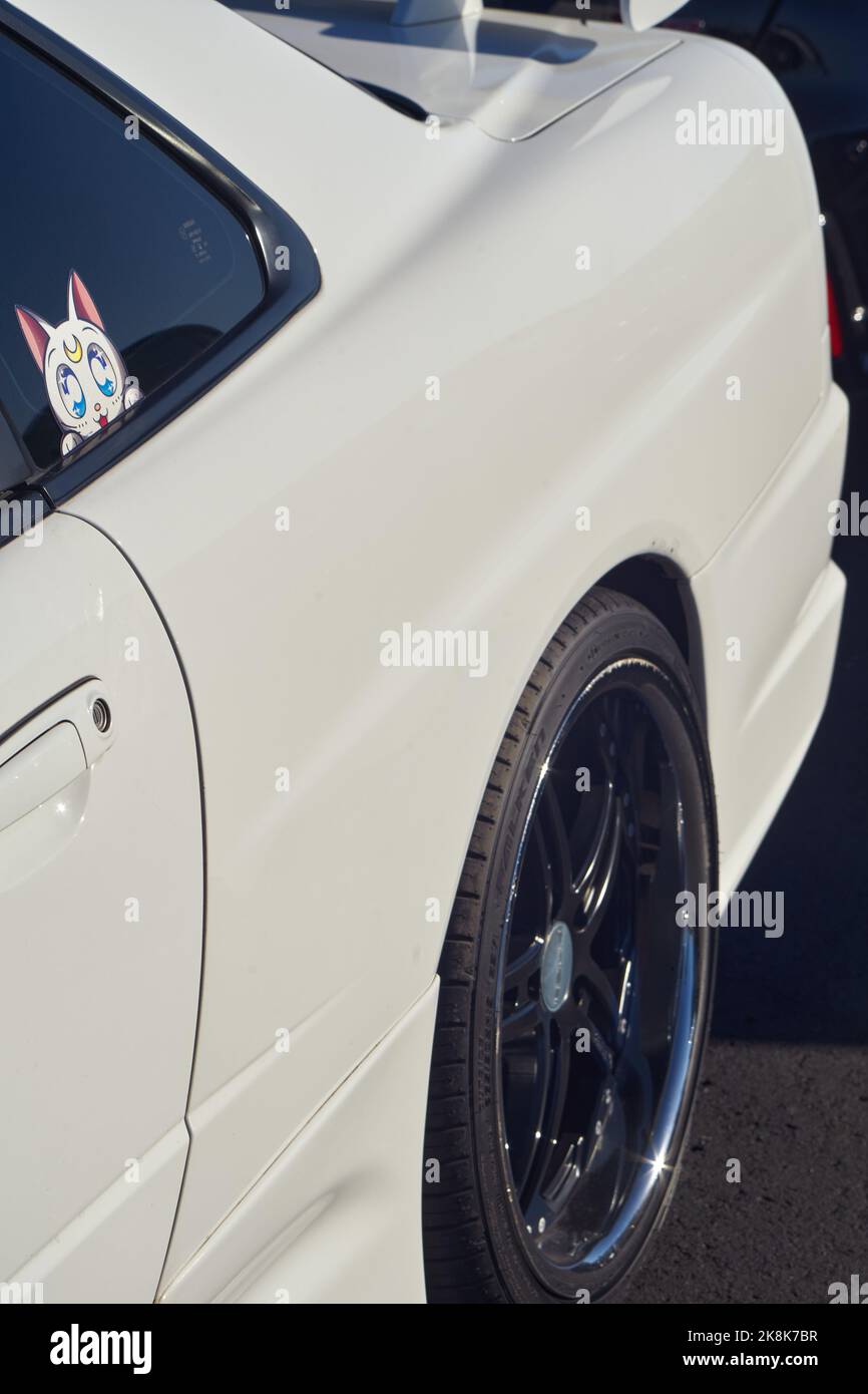 A vertical shot of a car with a sailor moon sticker on the window Stock ...