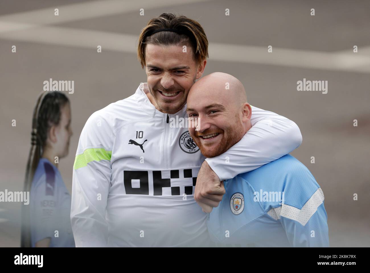 Manchester City's Jack Grealish (left) with kitman Brandon Ashton ...