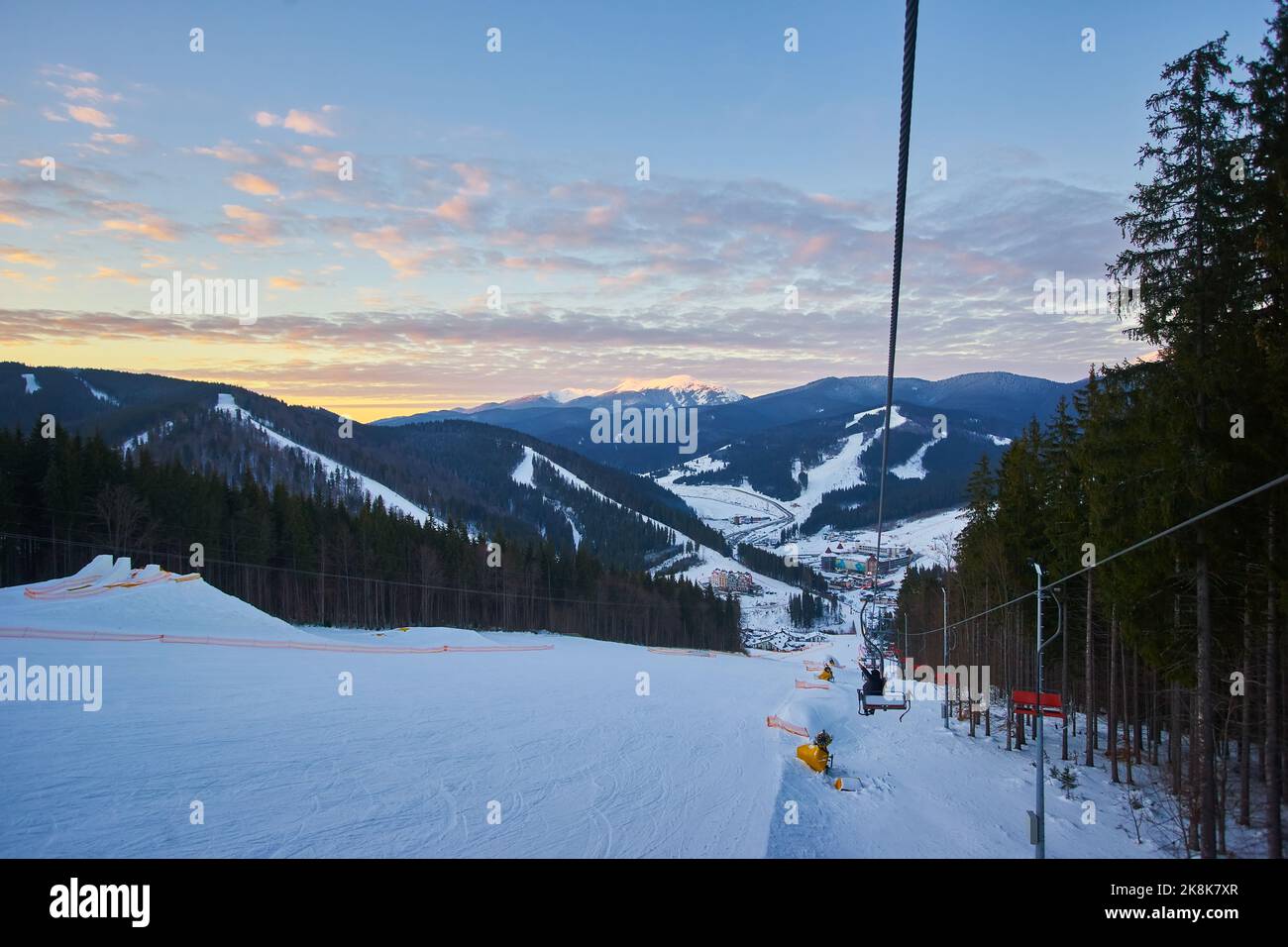 Winter resort with slopes for skiing and snowboarding with houses and ...