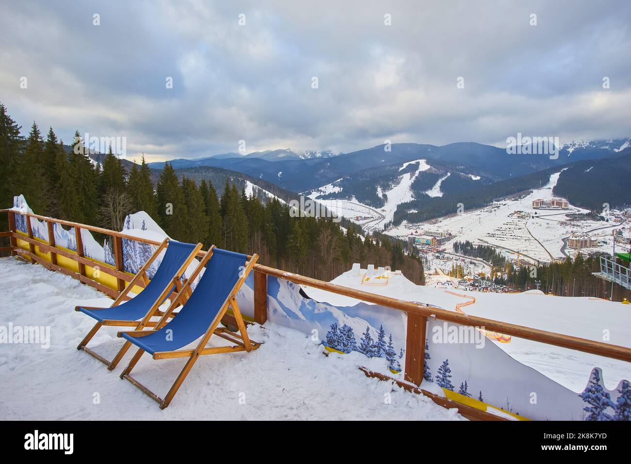 Winter resort with slopes for skiing and snowboarding with houses and ...