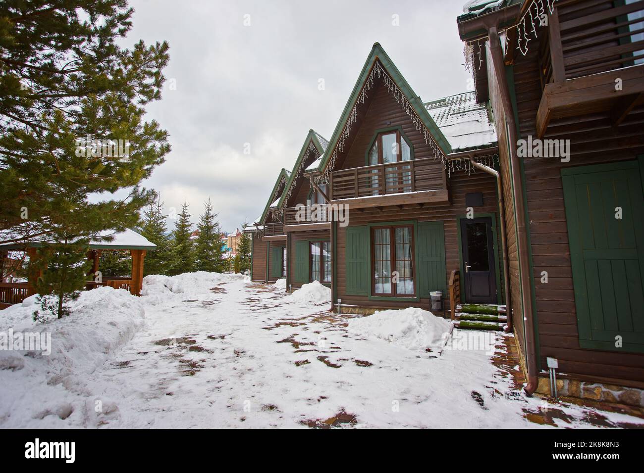Winter resort with slopes for skiing and snowboarding with houses and ...