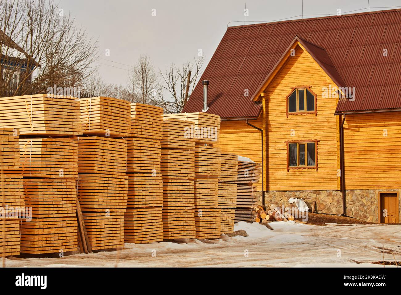 Wood boards piles stored outdoor, lumber storage. Stacked wooden boards ...