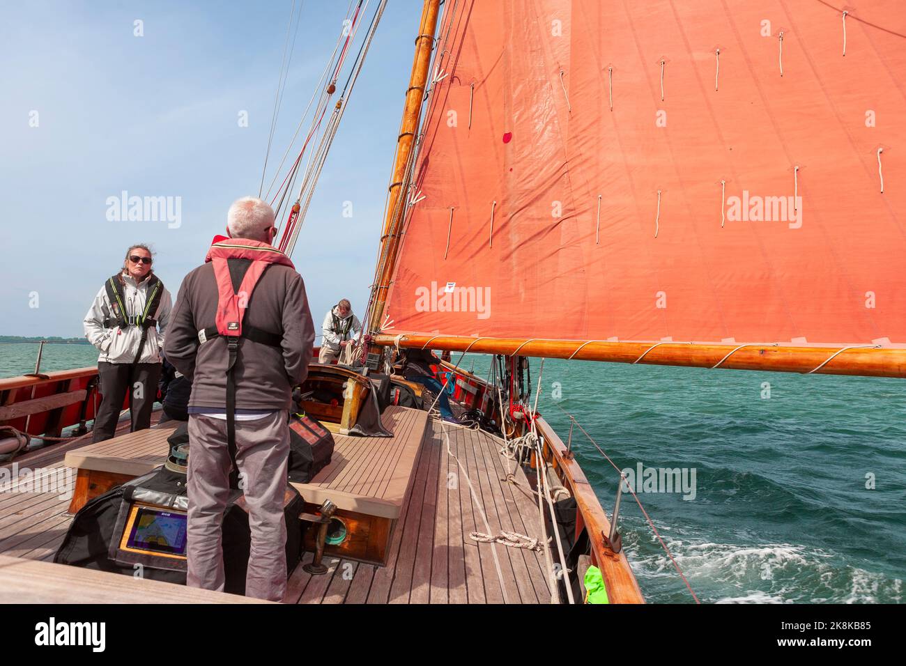 The skipper supervising work aboard the traditional gaff cutter "Jolie ...