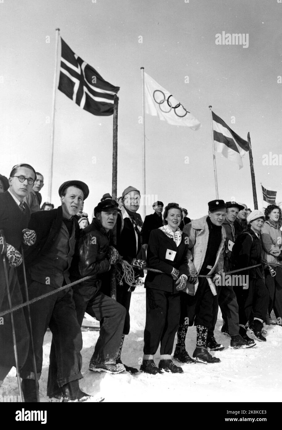 Olympics in Oslo 1952: People's life from the stands. Norwegian flag ...