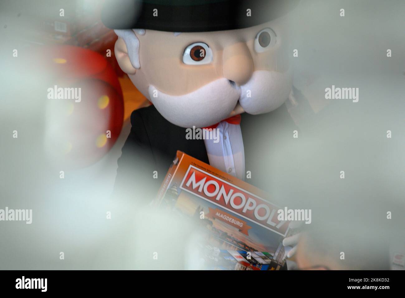 Magdeburg, Germany. 24th Oct, 2022. The mascot "Mr. Monopoly" holds a ...