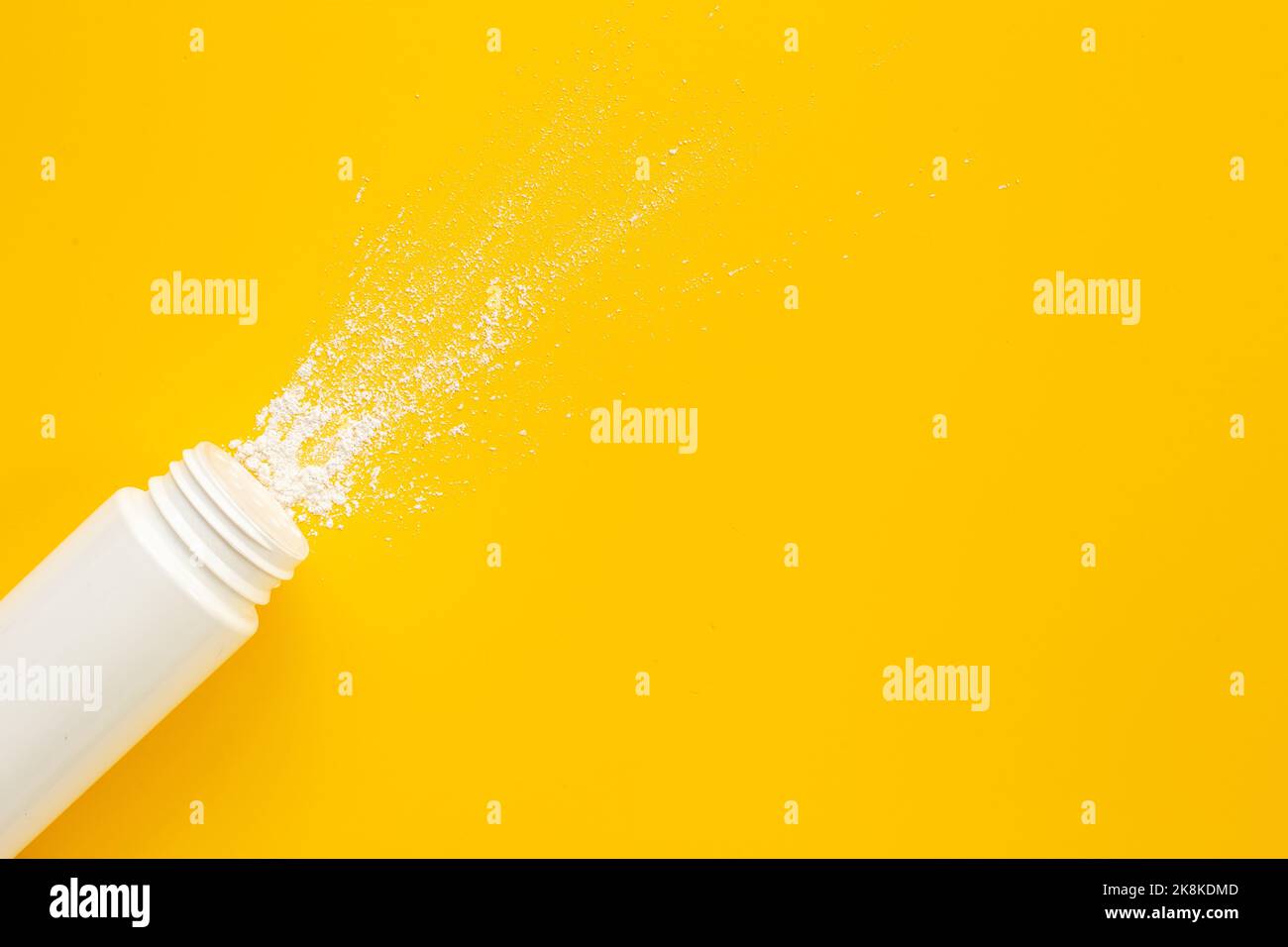 Skin care with talcum powder in container. Spilled white powder Stock ...